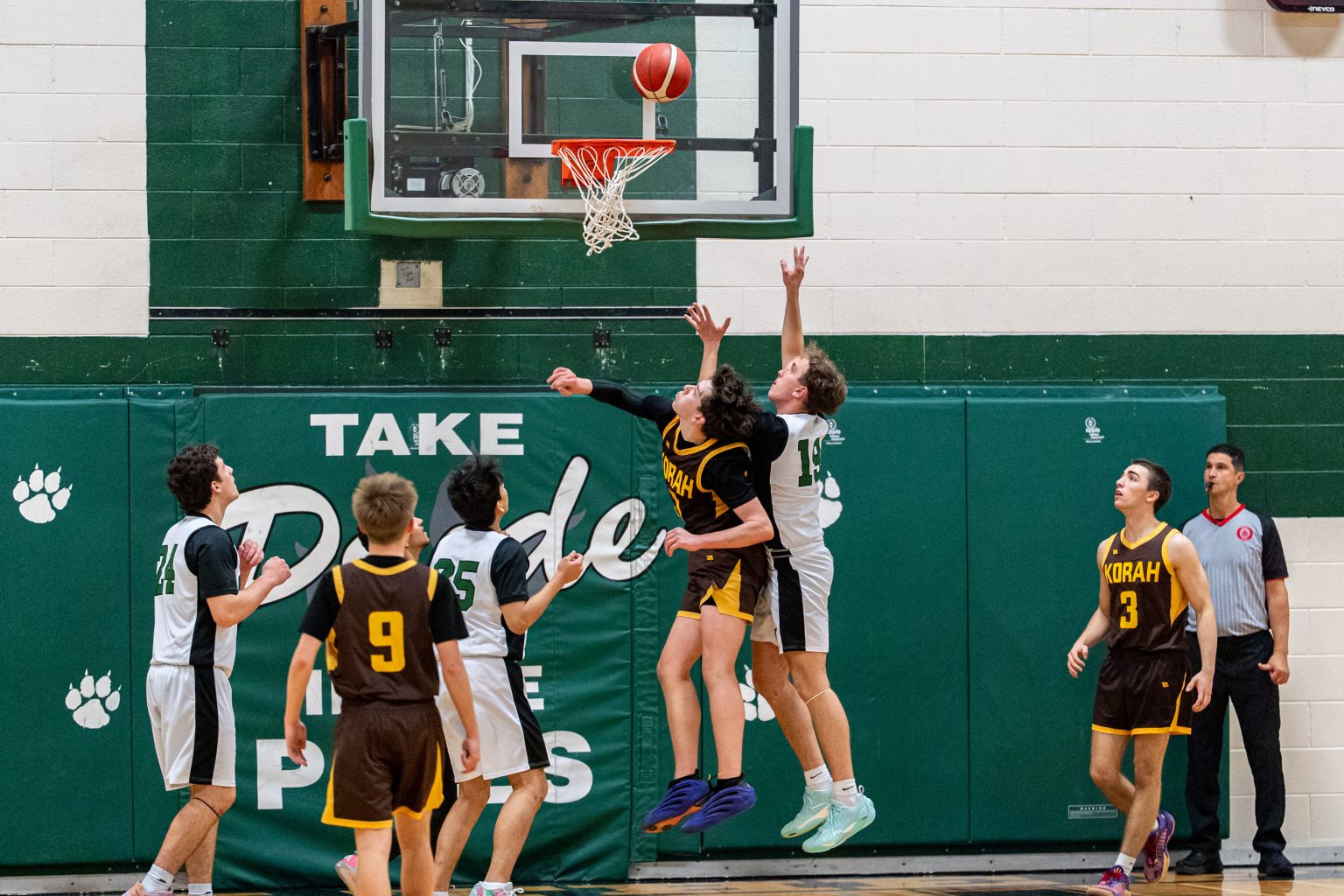 Wolverines and Colts Split Doubleheader in High School Basketball Action